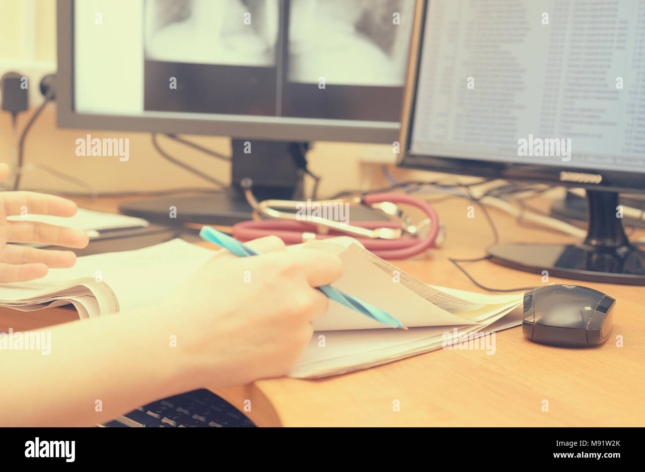 The radiologist looks at the x-ray images on a computer monitor Stock ...