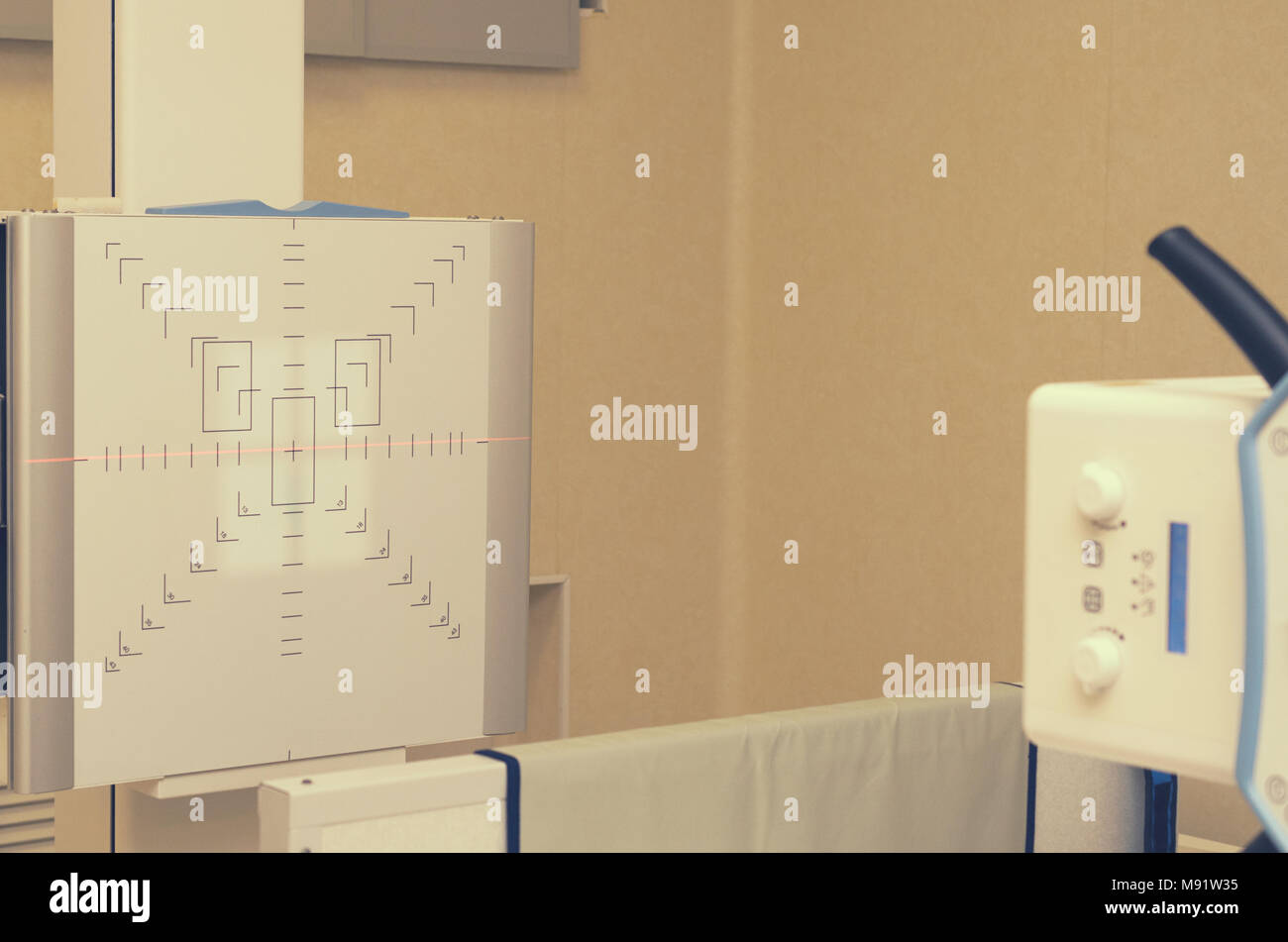 Room with an X-ray apparatus table for the production of X-ray images ...