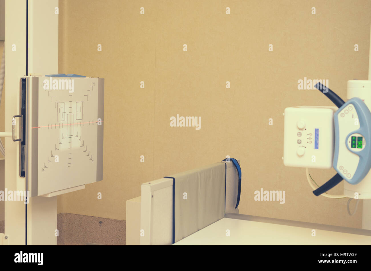 Room with an X-ray apparatus table for the production of X-ray images ...