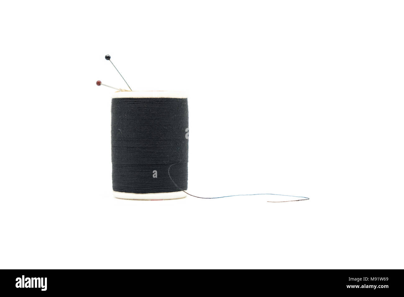 Pin and black thread isolated on white background Stock Photo - Alamy