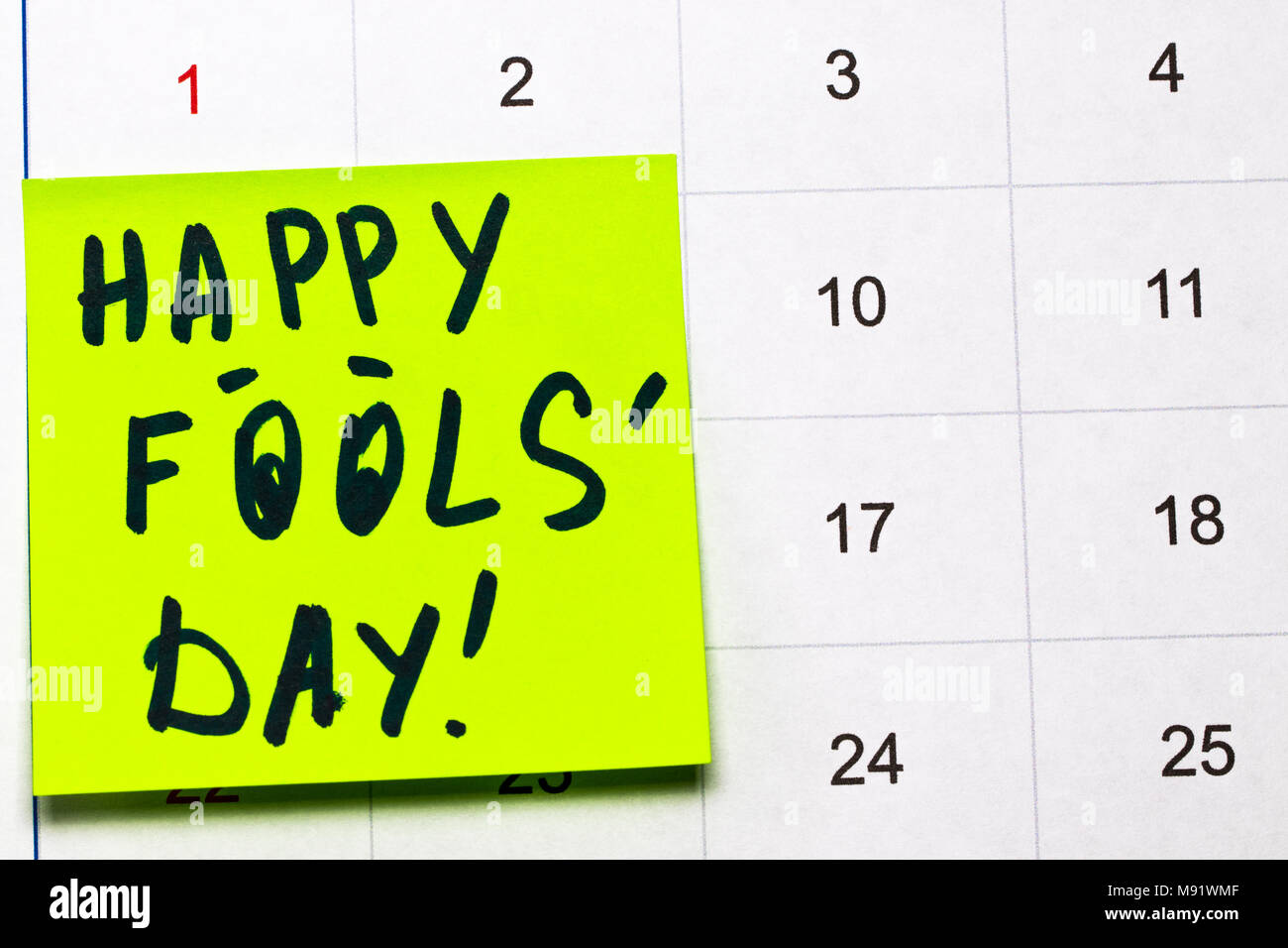 Sticky note with word "Kick me" on man's back, closeup. 1st April Fools ...