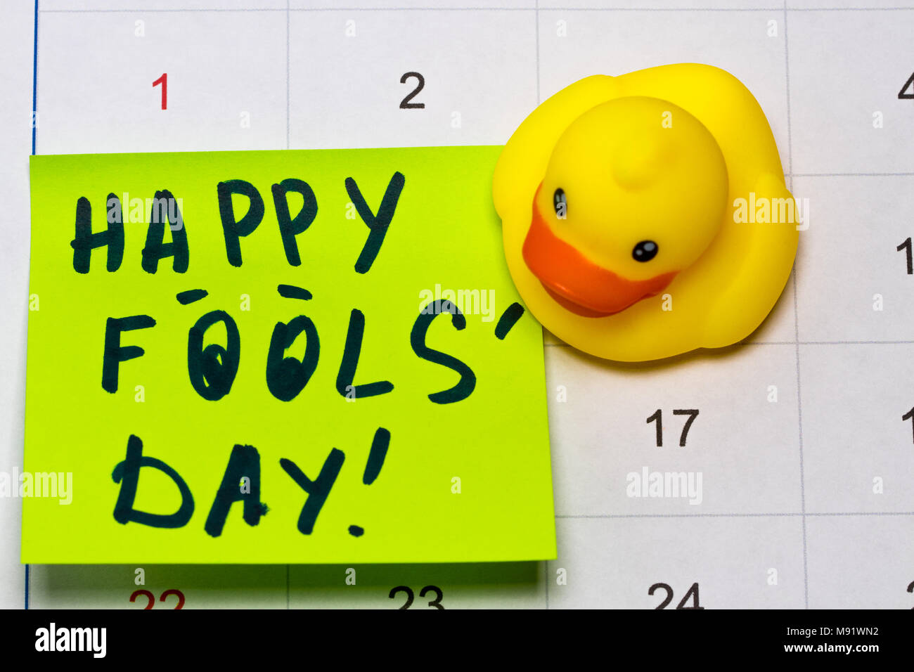 Sticky note with word "Kick me" on man's back, closeup. 1st April Fools ...