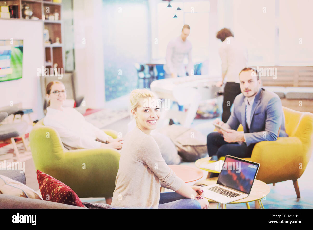 Group of a young business people discussing business plan at modern ...