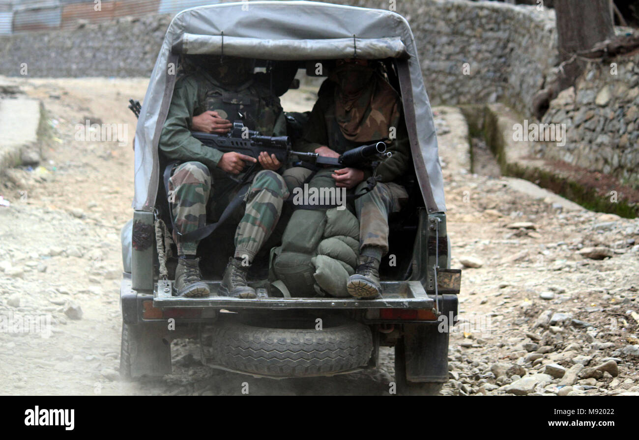 Srinagar, Kashmir. 21st Mar, 2018.Indian Army vehicle arrive on site of ...