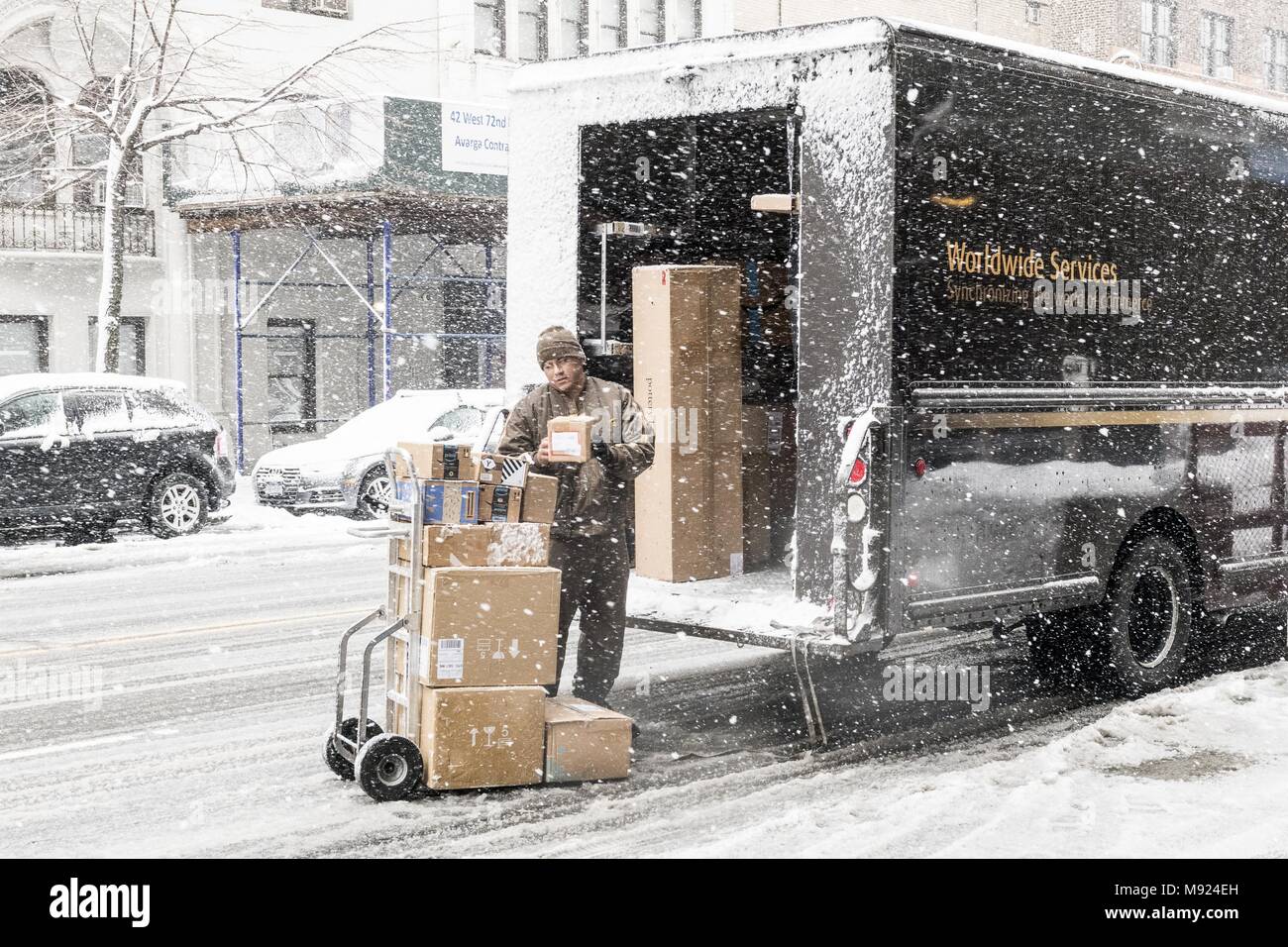 New York, NY, USA. 21st Mar, 2018. Unloading a UPS (Unted Parcel ...