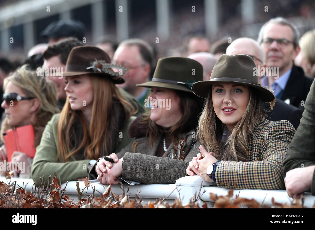Female racegoers watch the action in the JCB Triumph Hurdle during Gold ...