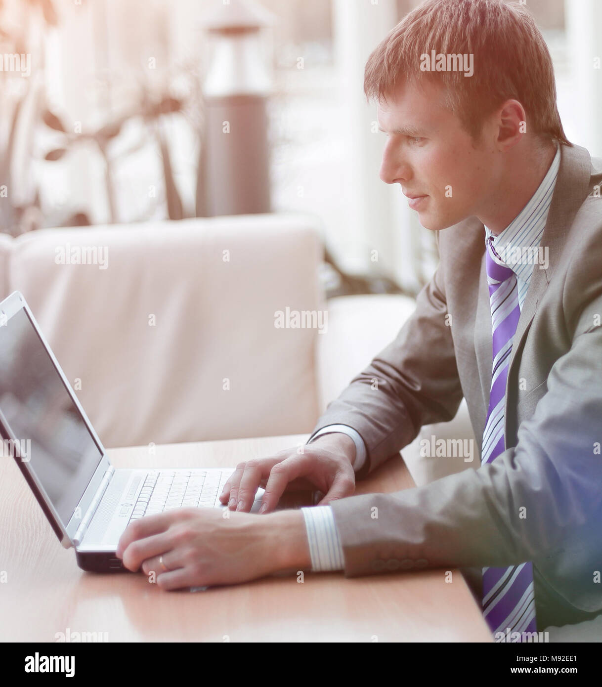 Young employee looking at computer monitor during working day Stock ...