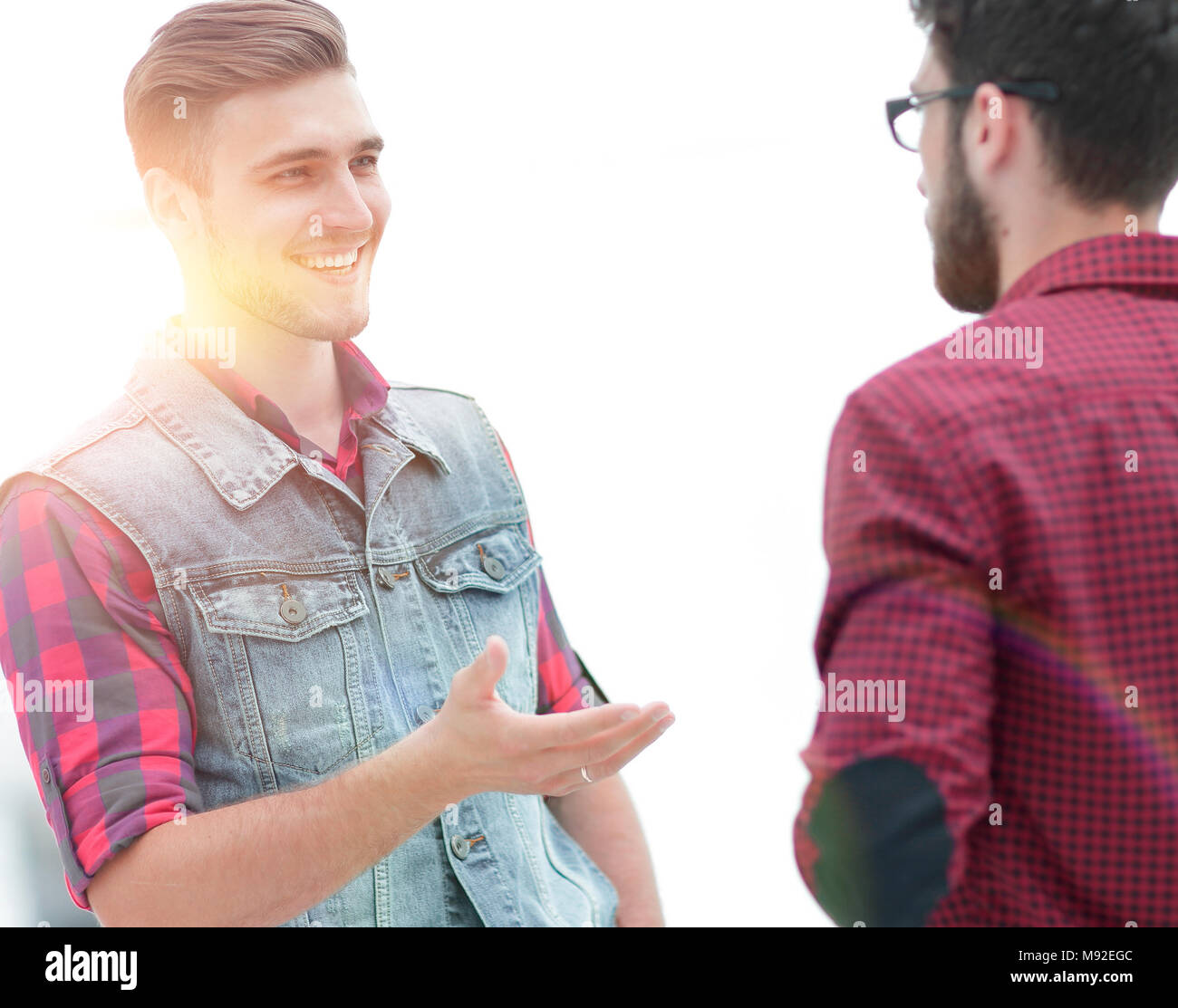 two active young men talking Stock Photo - Alamy