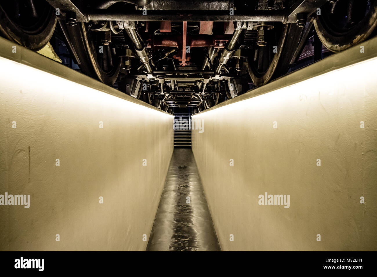 The underneath of an old train with a corridor underneath it Stock ...