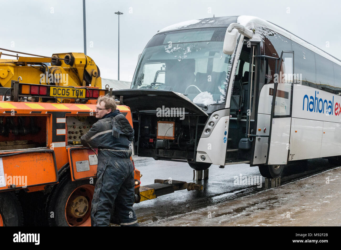 final preperations being undertaken by a Mechanic to tow a National ...