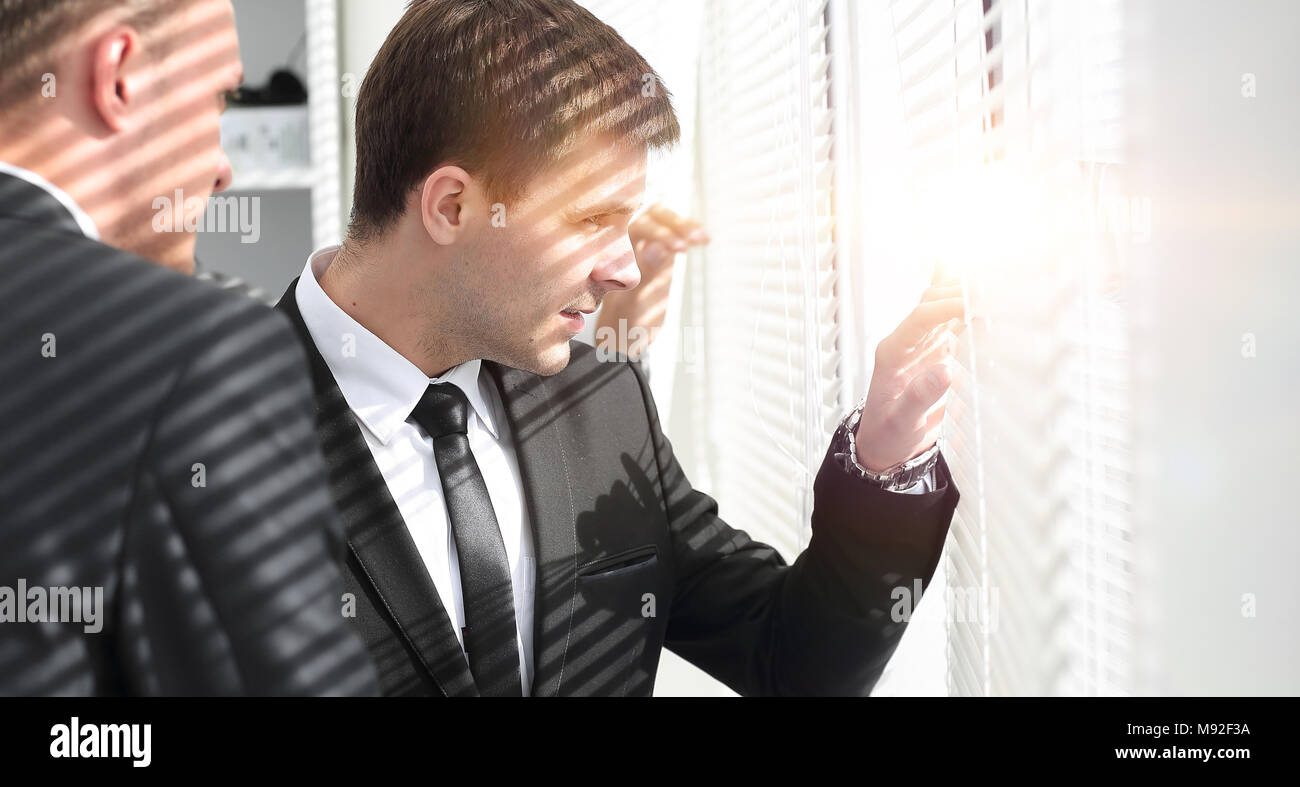 business people look in the window office Stock Photo - Alamy