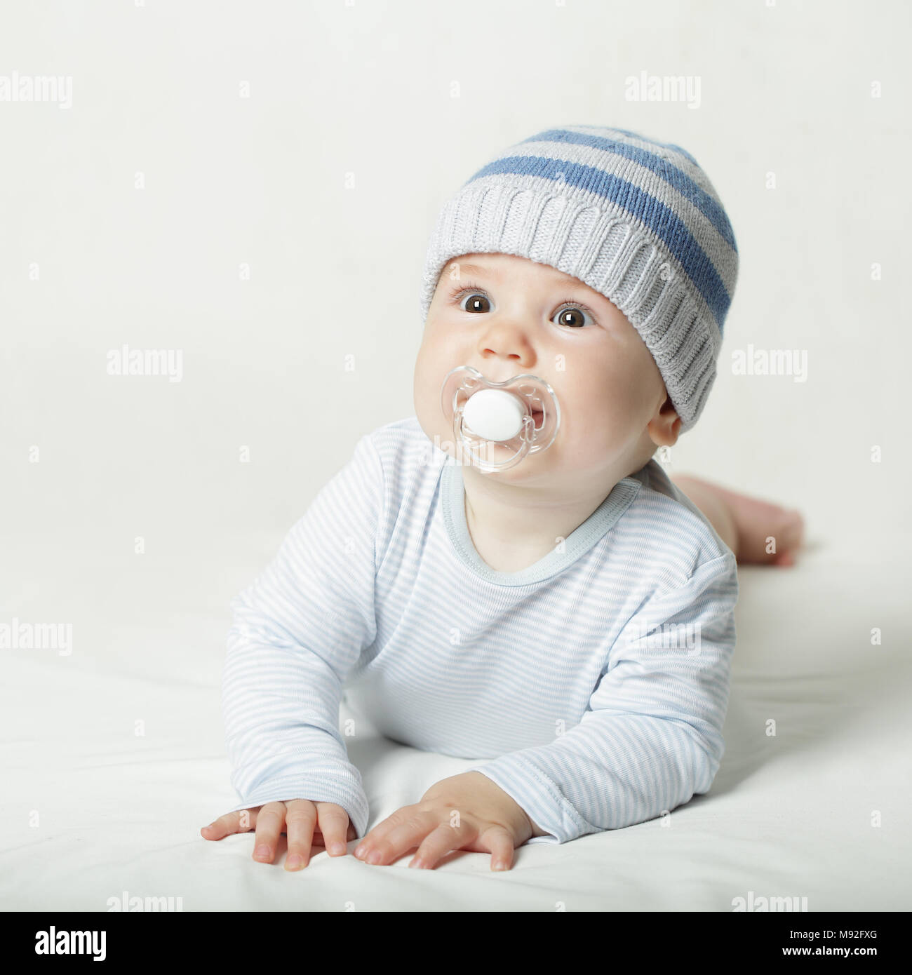 Cute baby in blue clothes Stock Photo - Alamy