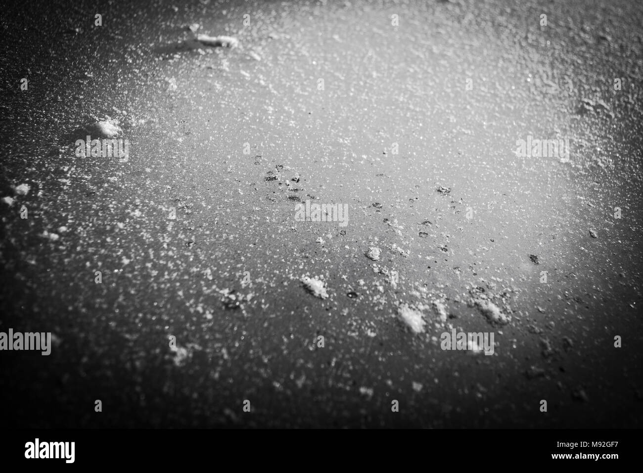 Ice and snow texture, black and white. Abstract background from a ...