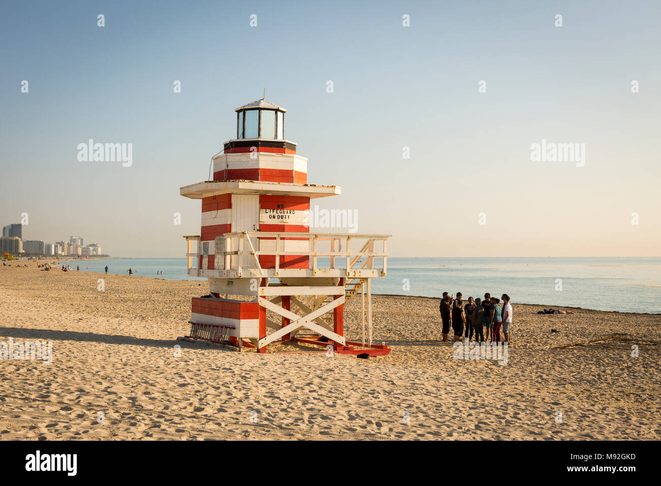 People gather in front of one South Beach's iconic lifeguard towers at ...