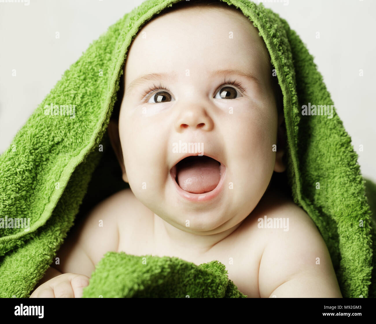 Happy baby looking up Stock Photo - Alamy