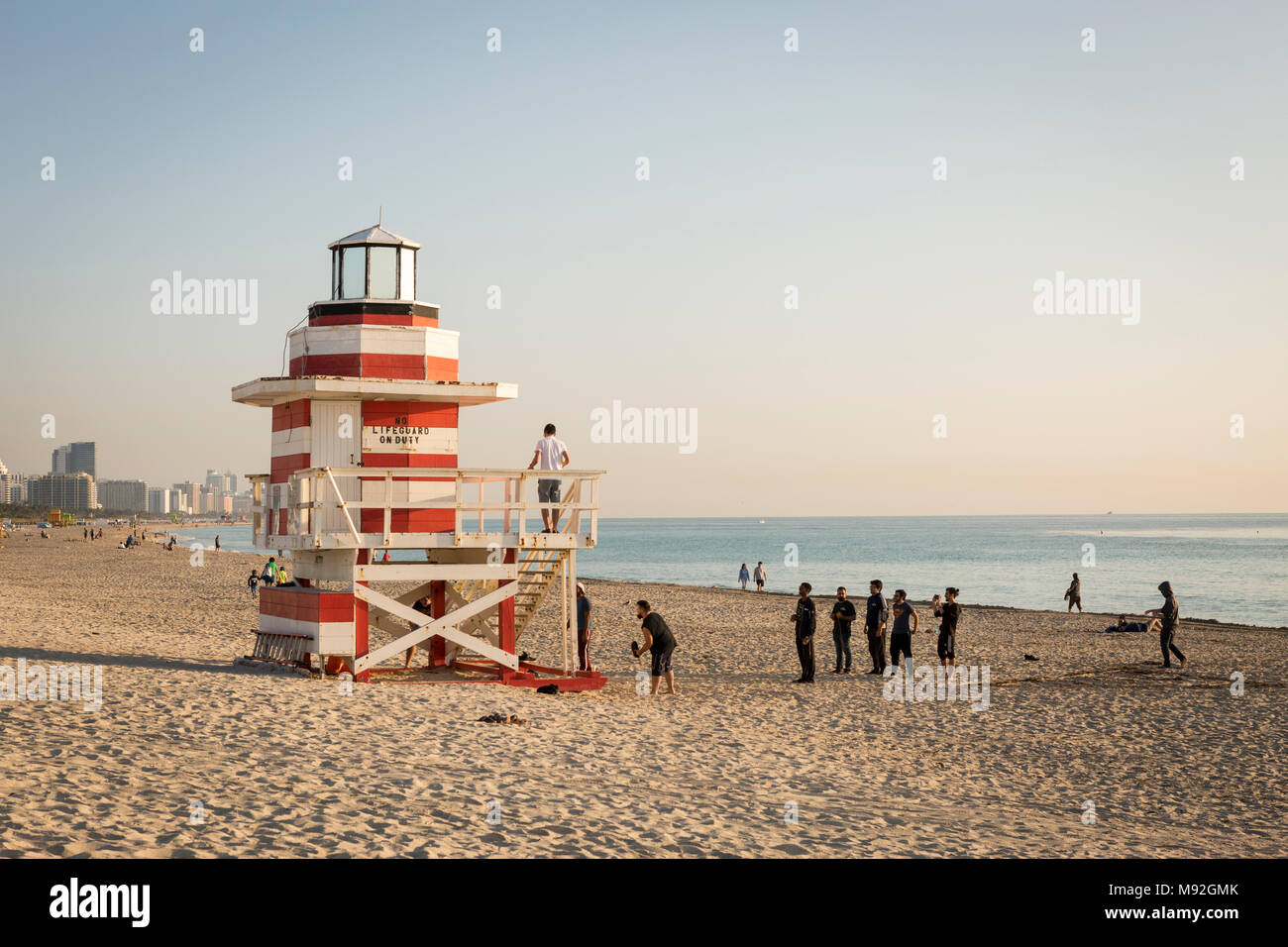 People gather in front of one South Beach's iconic lifeguard towers at ...