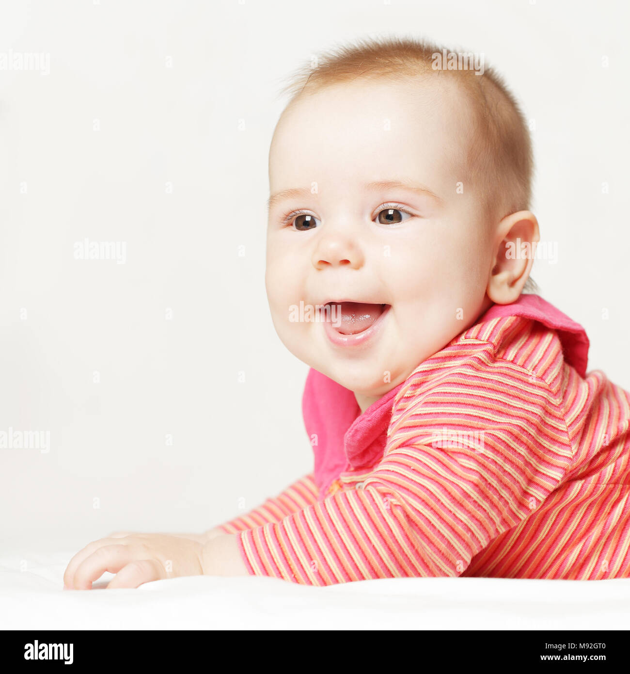 Little baby girl wearing a red clothes Stock Photo - Alamy