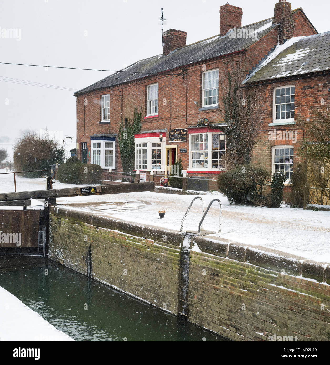 The boat shop on the grand union canal at braunston in the winter snow ...