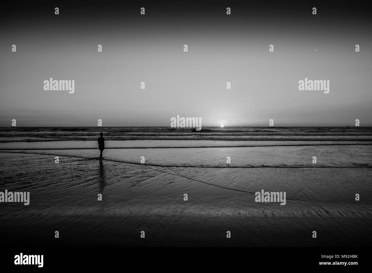 Figure at the Beach Stock Photo - Alamy
