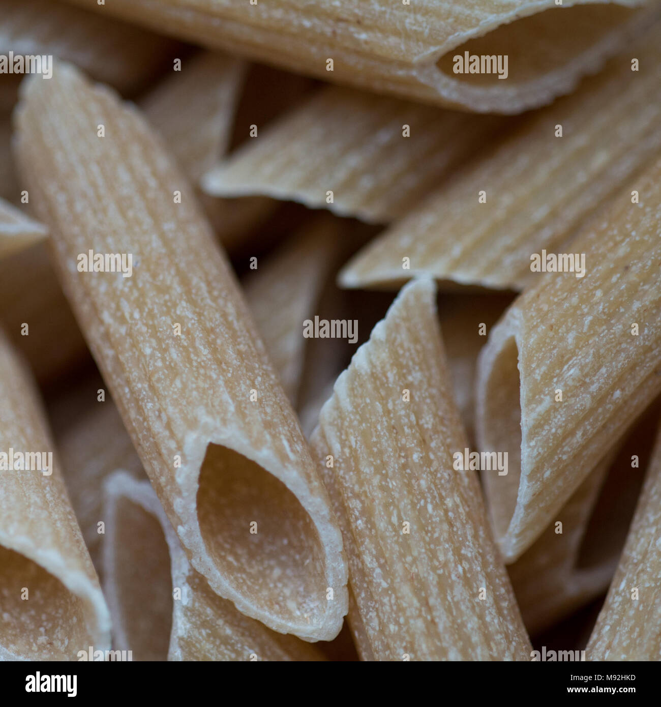 Bulk whole wheat pasta Stock Photo - Alamy