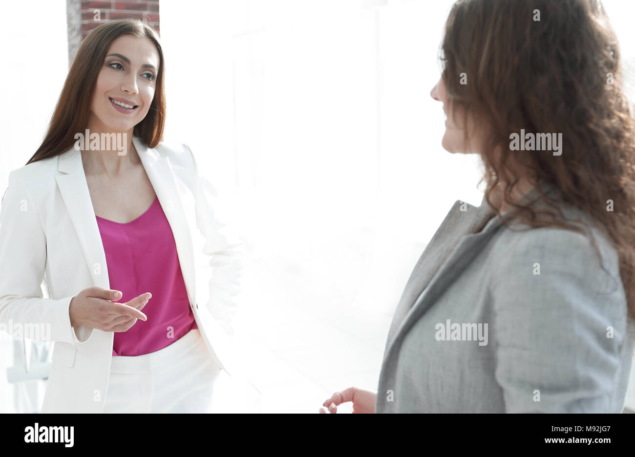 friendly lady Manager talking to a customer Stock Photo - Alamy