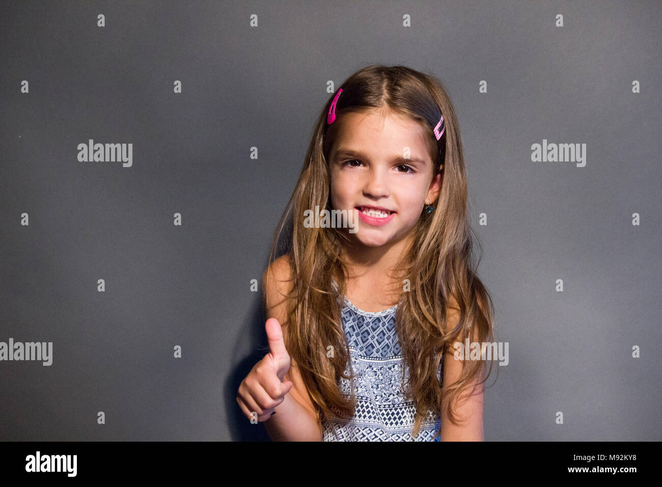 Cute little girl thumb up High Resolution Stock Photography and Images ...