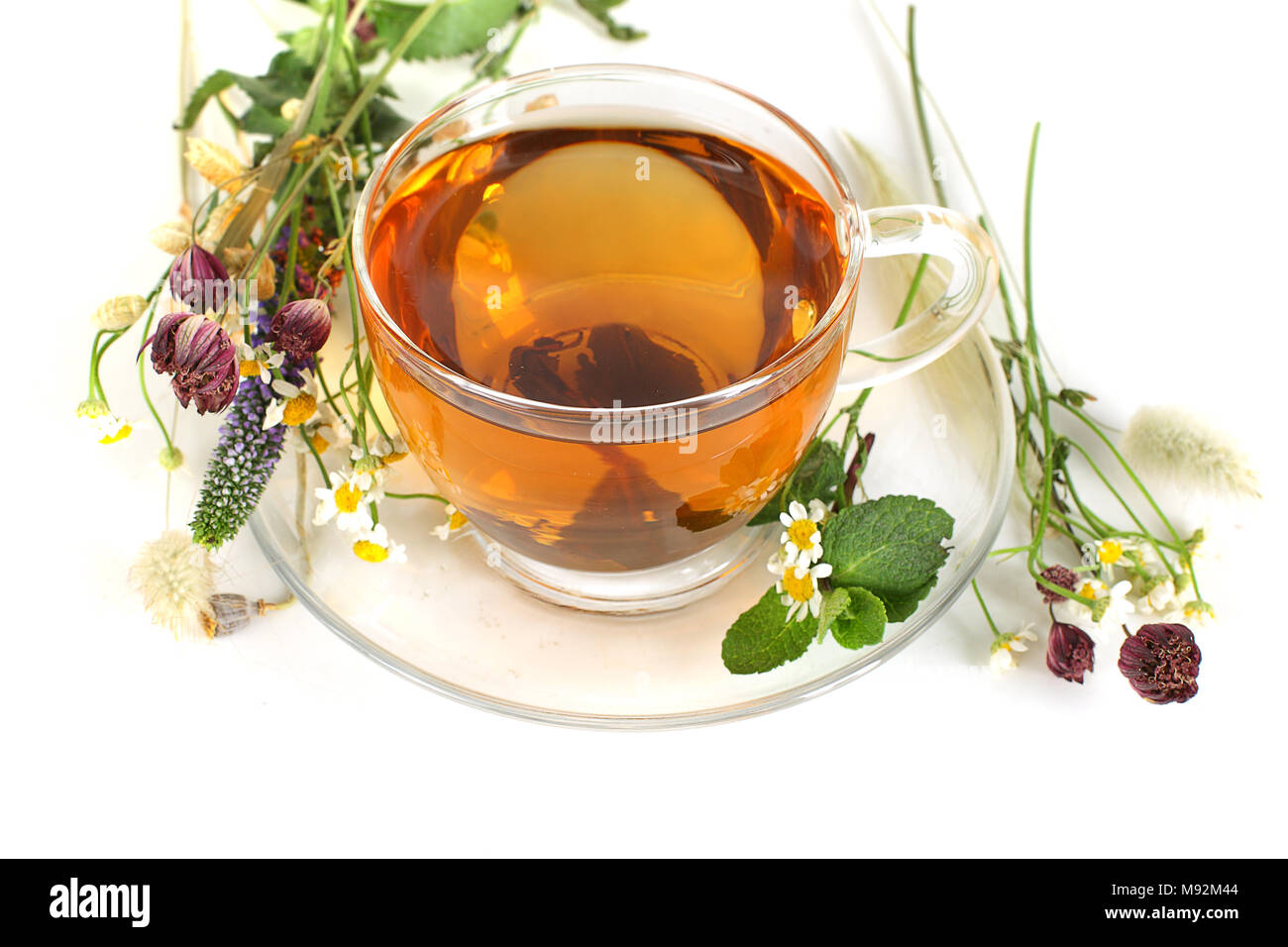 Tea and flowers on white background Stock Photo - Alamy