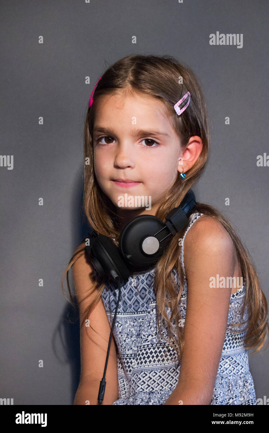 little girl studio portrait with headset Stock Photo - Alamy