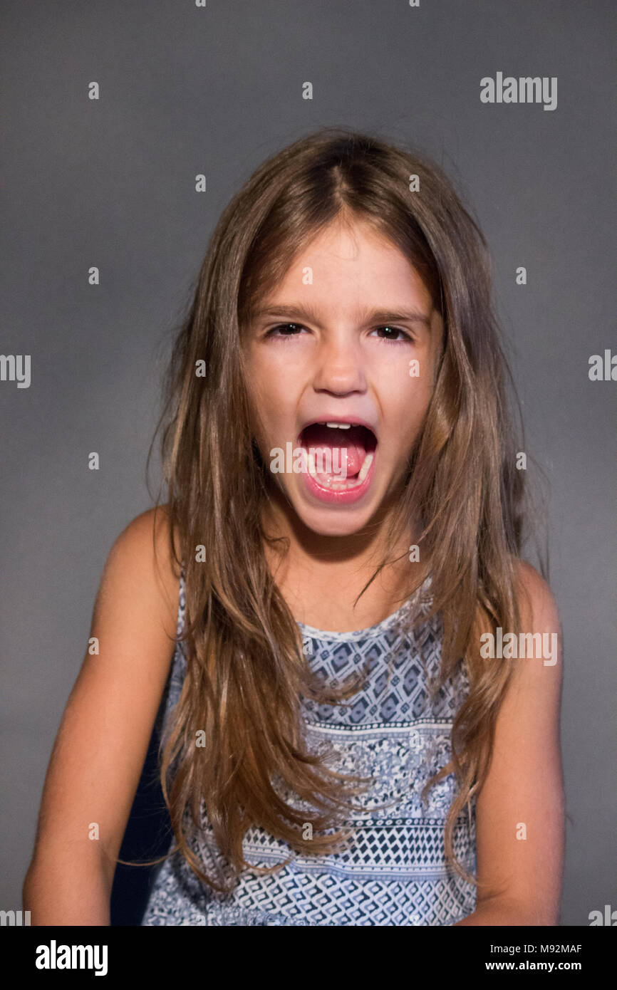 studio portrait girl screaming Stock Photo - Alamy