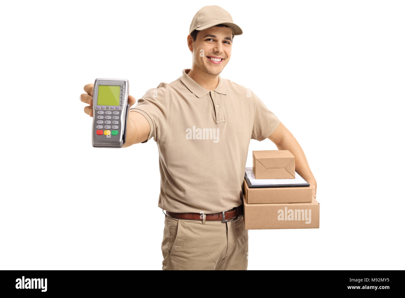 Delivery man holding a payment terminal and packages isolated on white ...