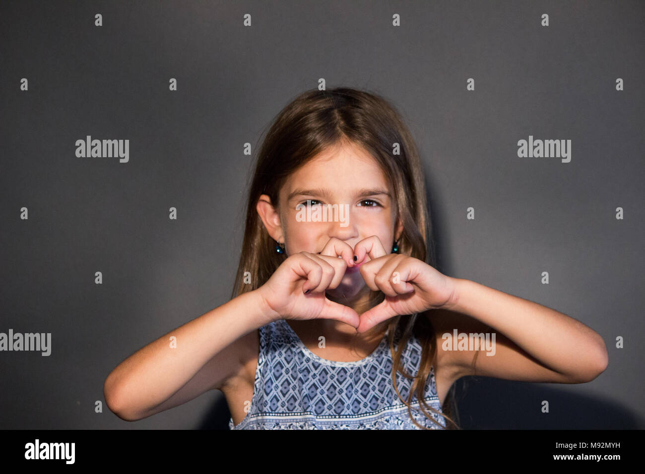 Child hands heart shape face hi-res stock photography and images - Alamy