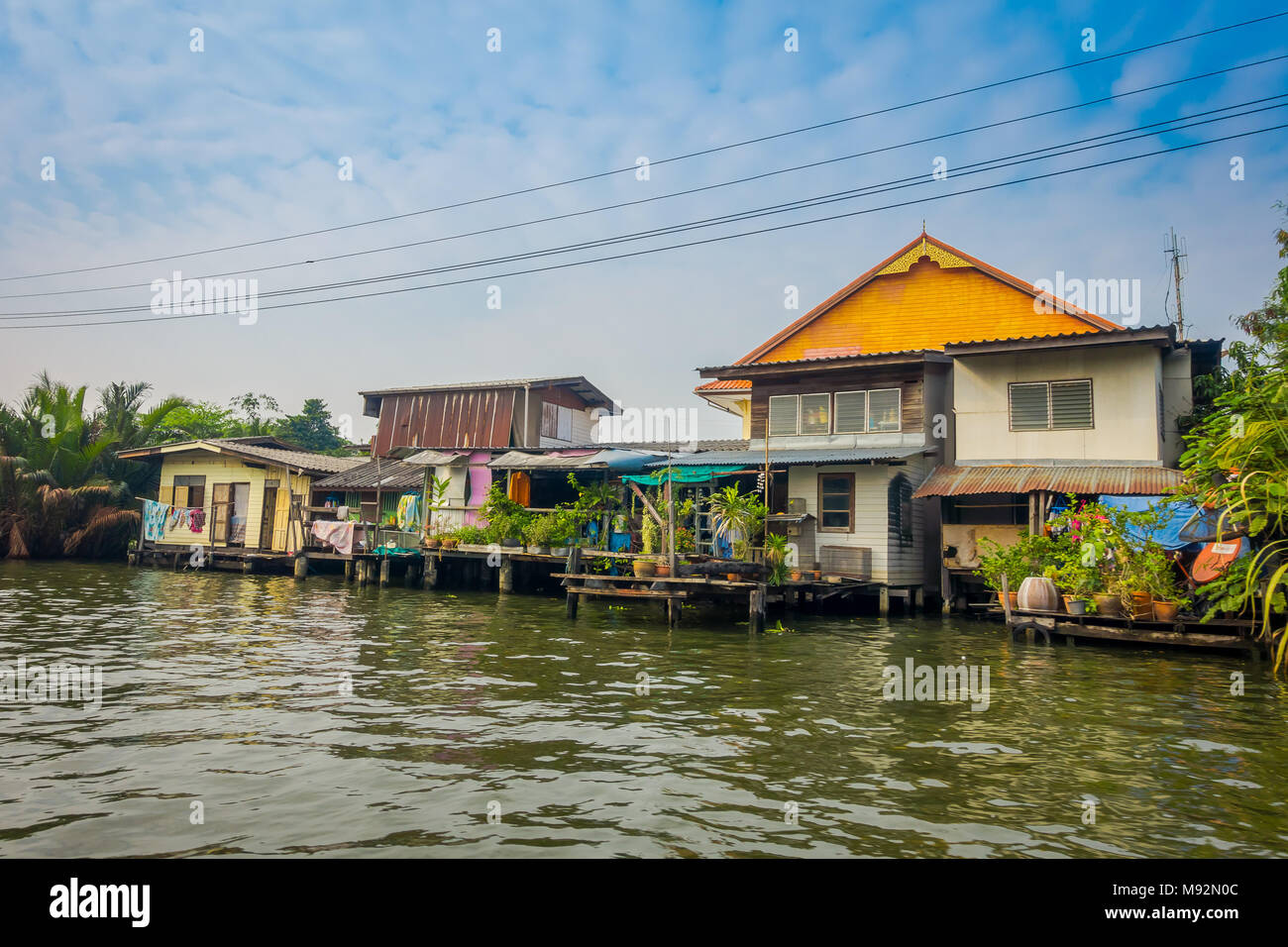 Outdoor view of floating wooden poor house located on the Chao Phraya ...