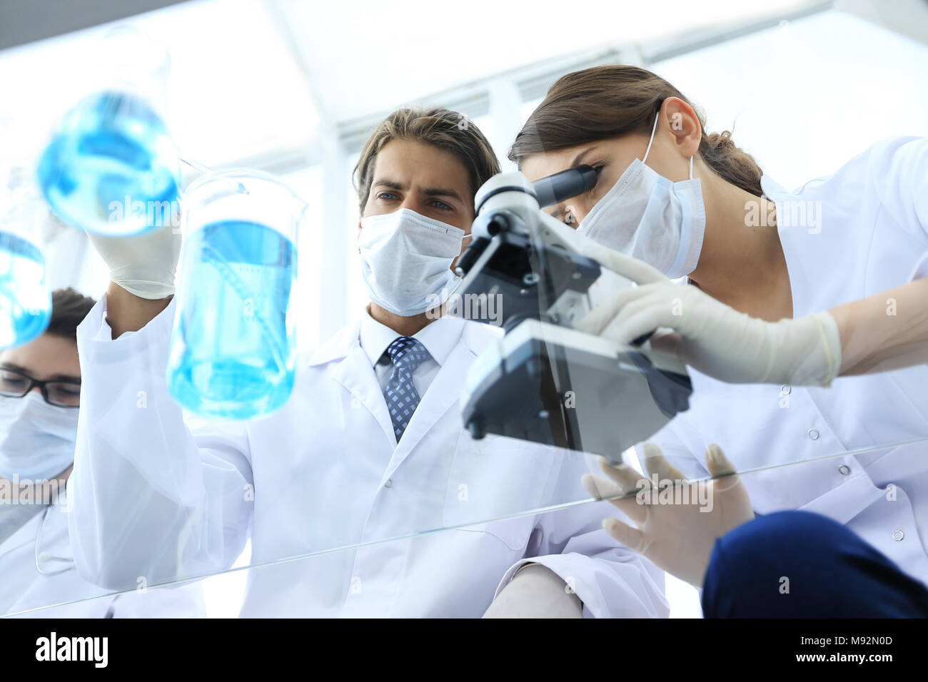 scientists conducting research in a lab environment Stock Photo - Alamy