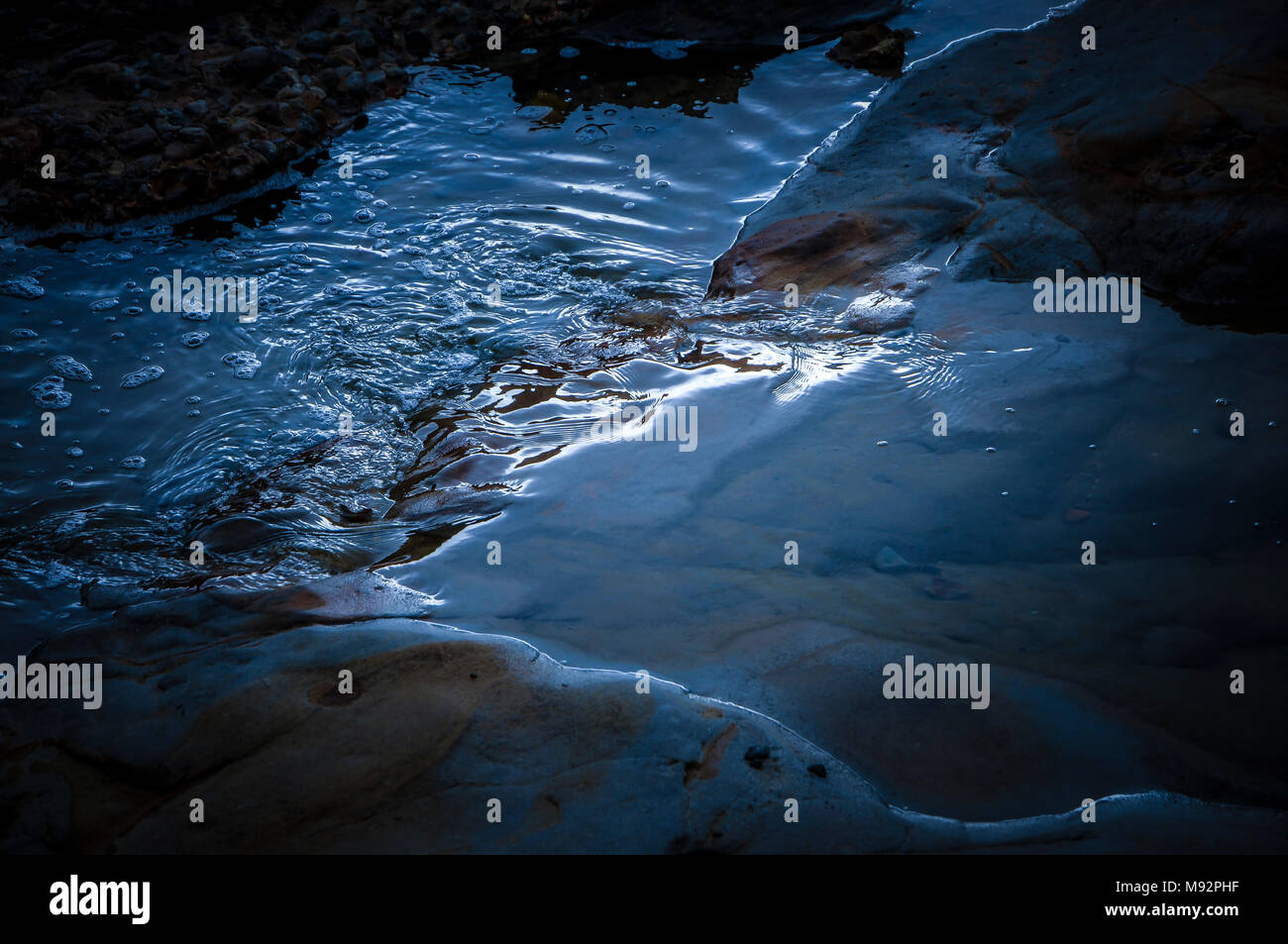 Beach with rocks and water Stock Photo - Alamy