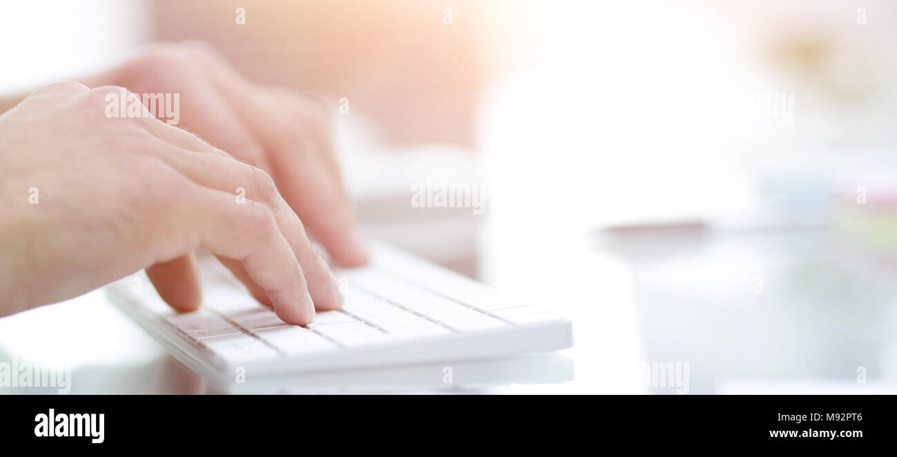 close-up of hand typing text on computer keyboard. Business background ...