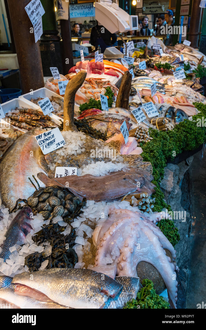 a selection of fresh fish on a fishmongers stall at borough market in ...