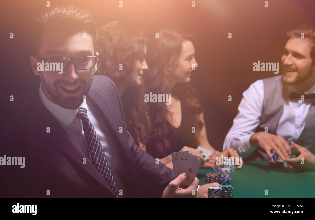 modern businessman playing poker in the night club Stock Photo - Alamy