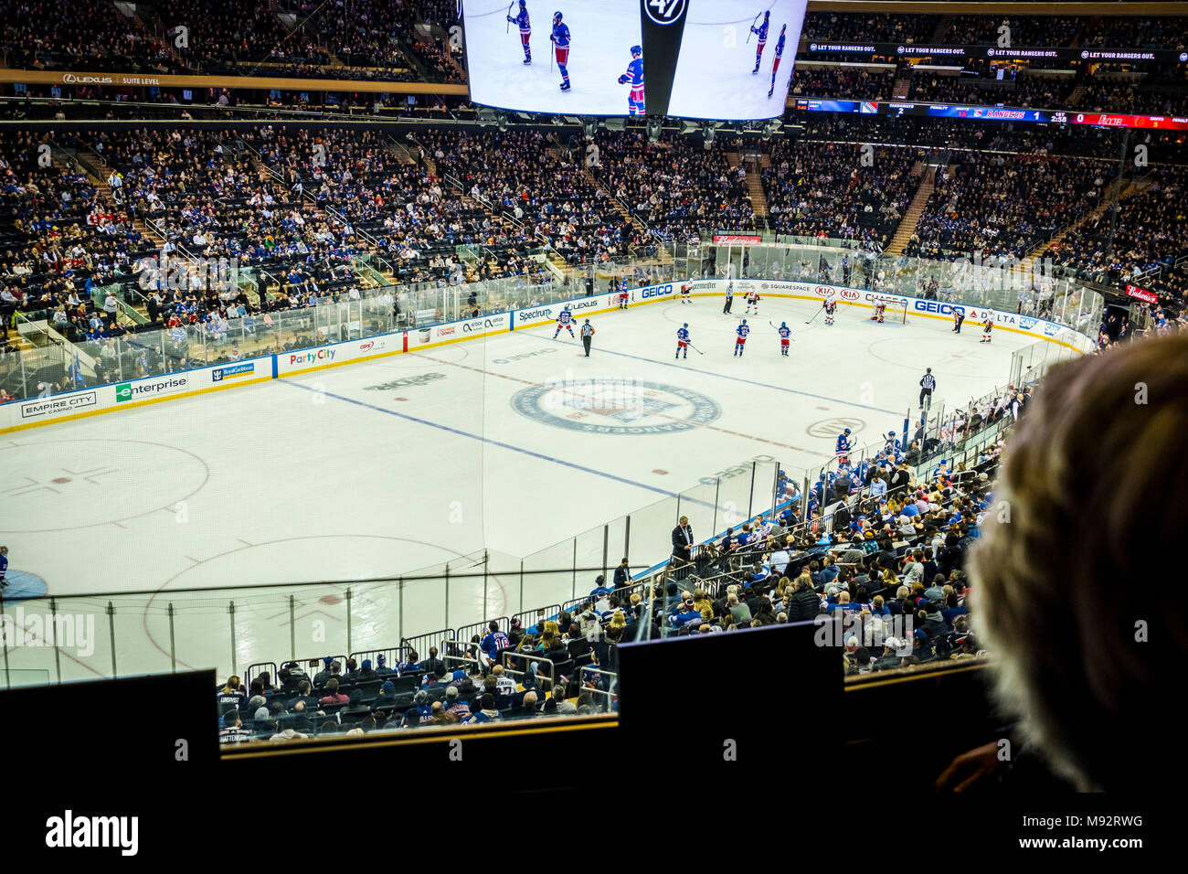 Spectators watching ice hockey game at Madison Square Garden, Manhattan ...