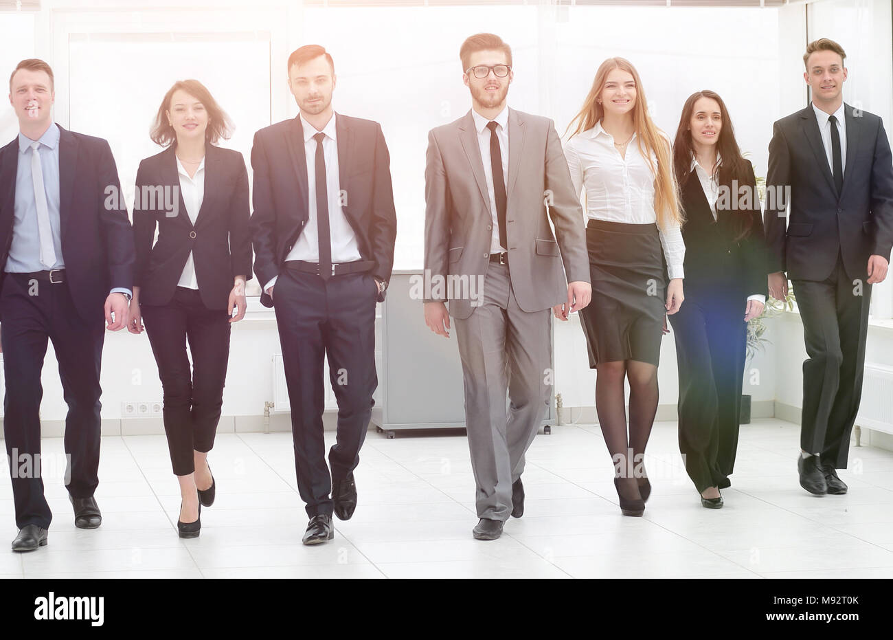 concept of victory. business team walking forward Stock Photo - Alamy