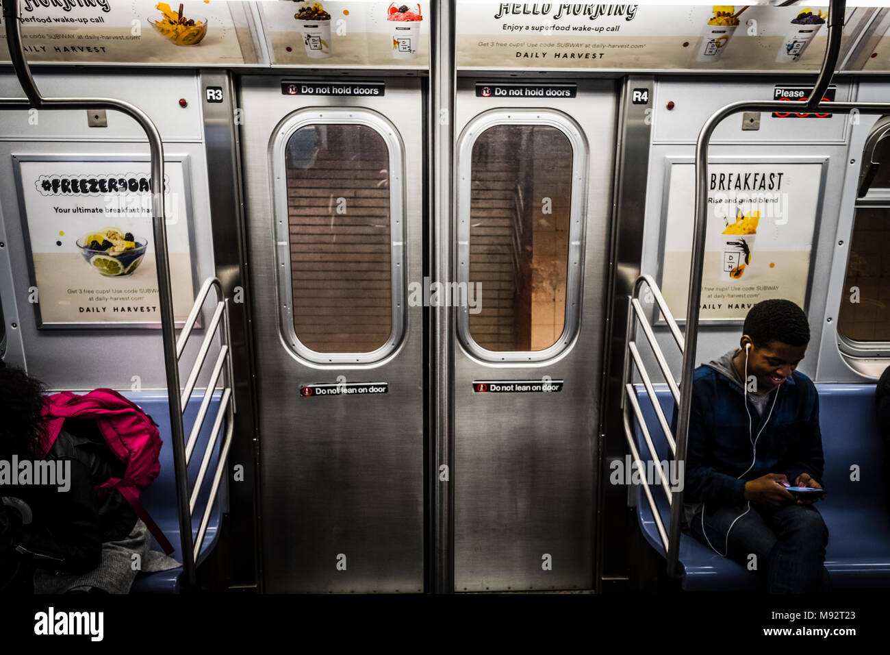 Commuters in subway wagon at New York subway system Stock Photo - Alamy