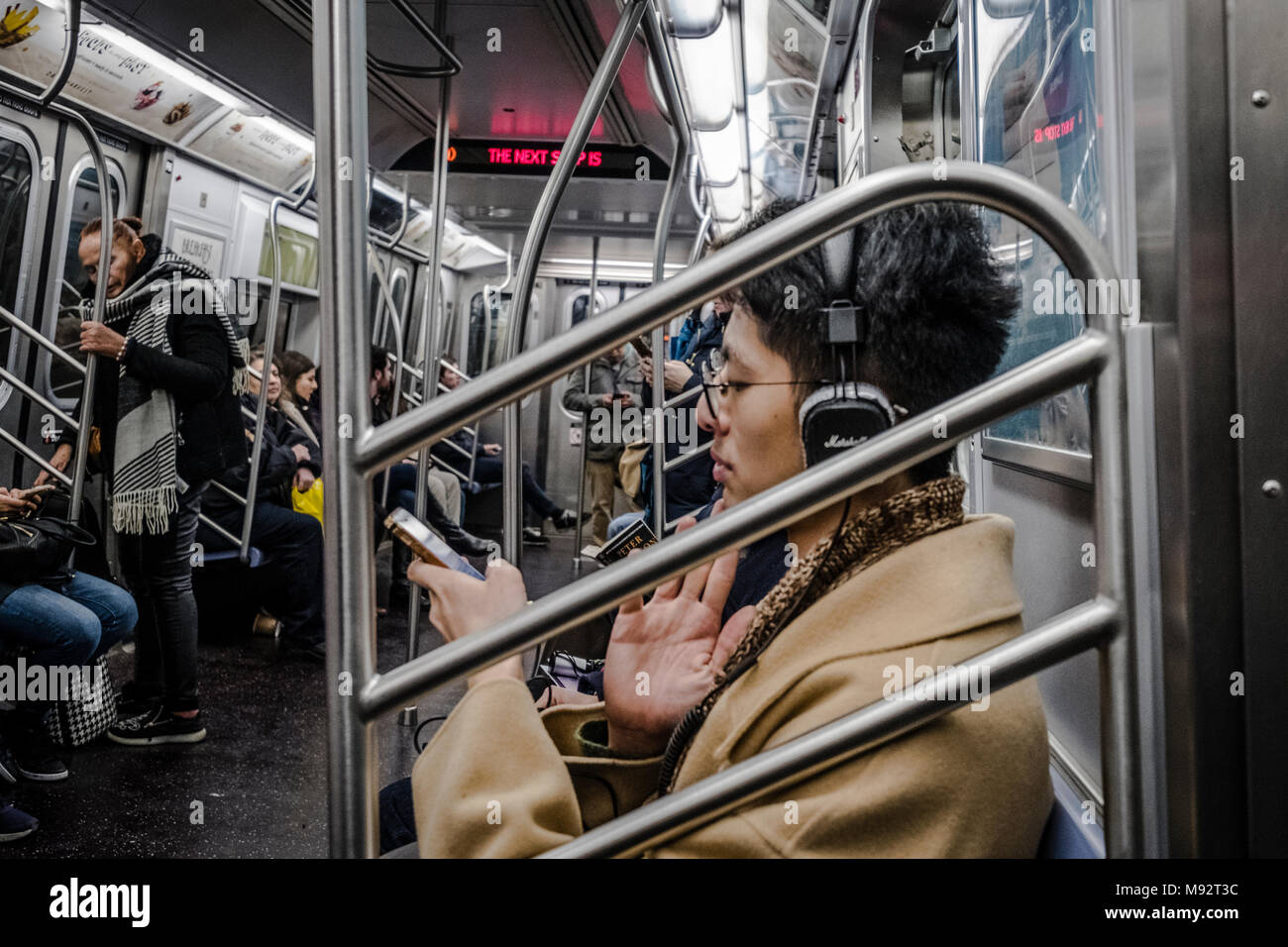 Commuters in subway wagon at New York subway system Stock Photo - Alamy