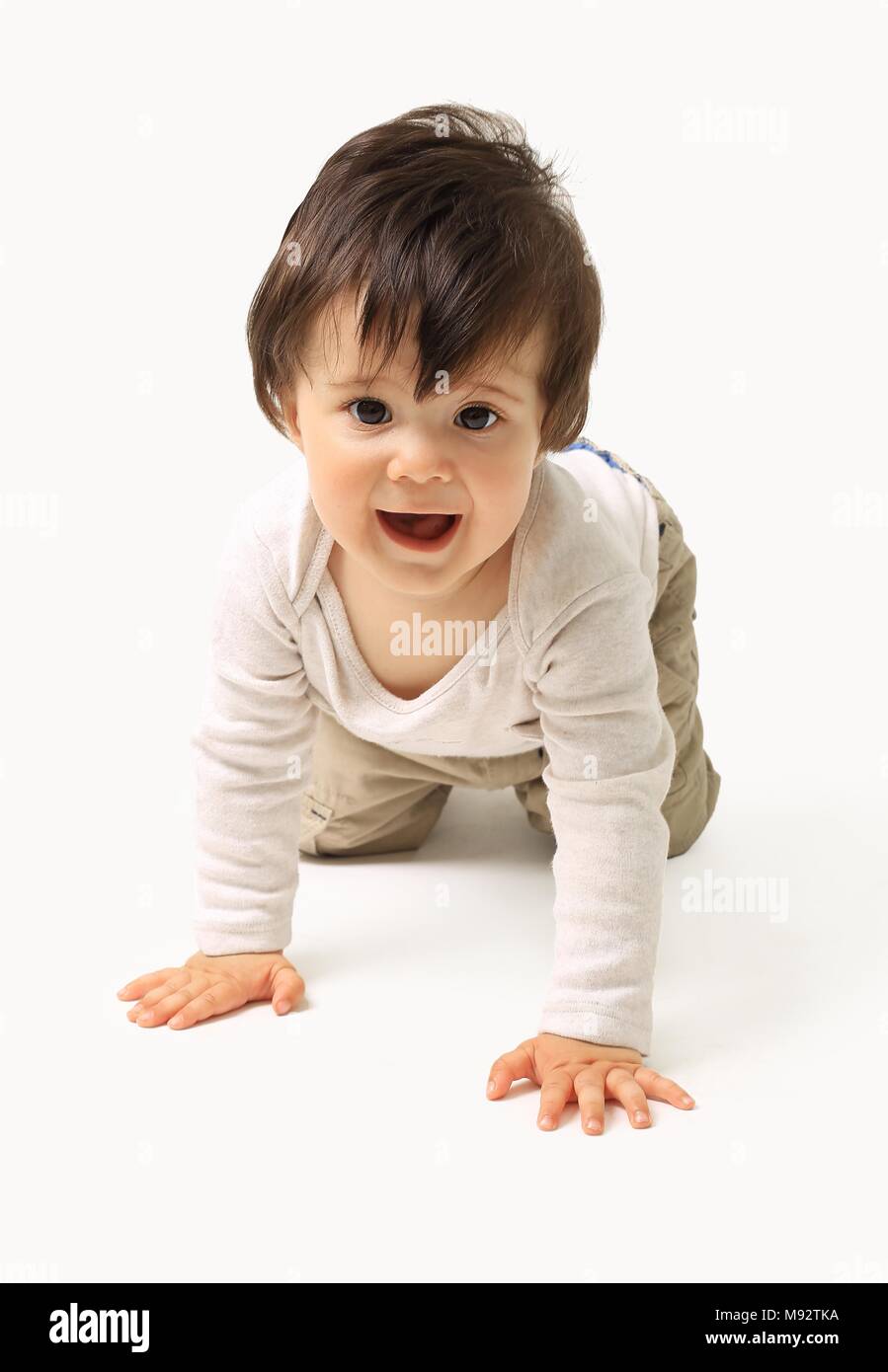 the baby learns to crawl isolated on white background Stock Photo - Alamy