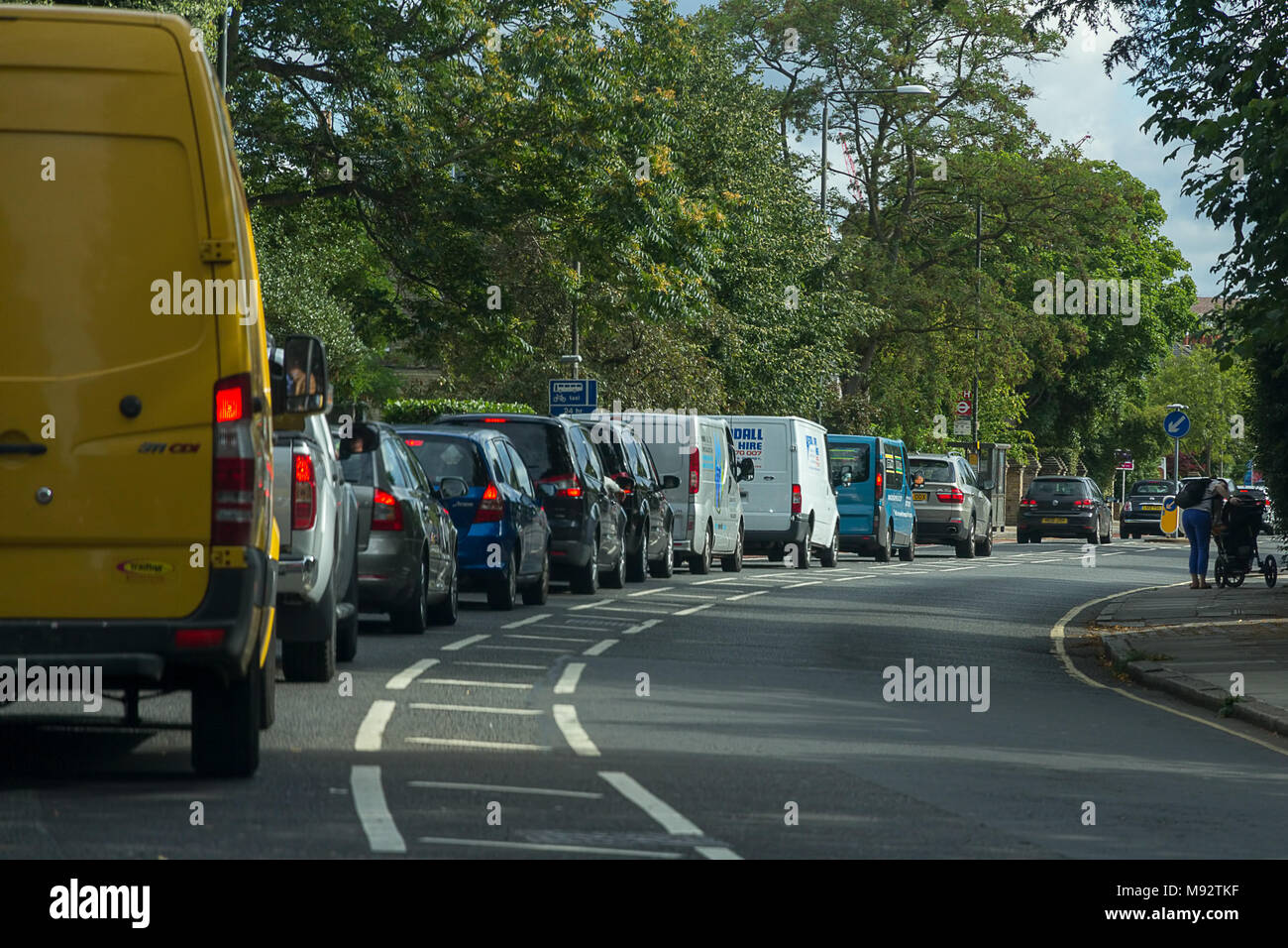 Cars and vans queueing in heavy traffic on a busy London road Stock ...
