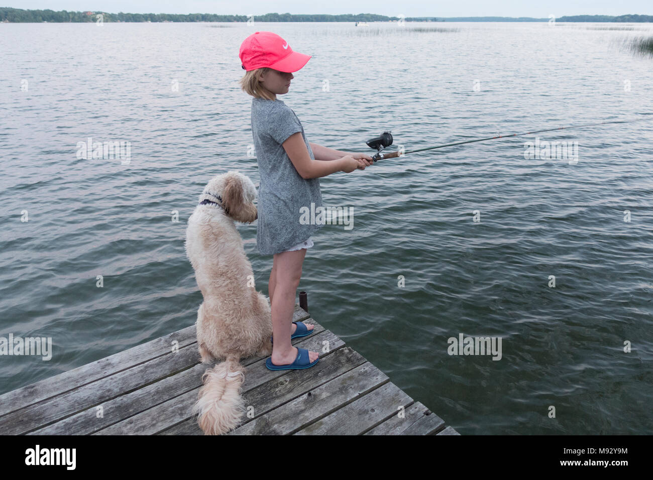 Girl at dock hi-res stock photography and images - Alamy