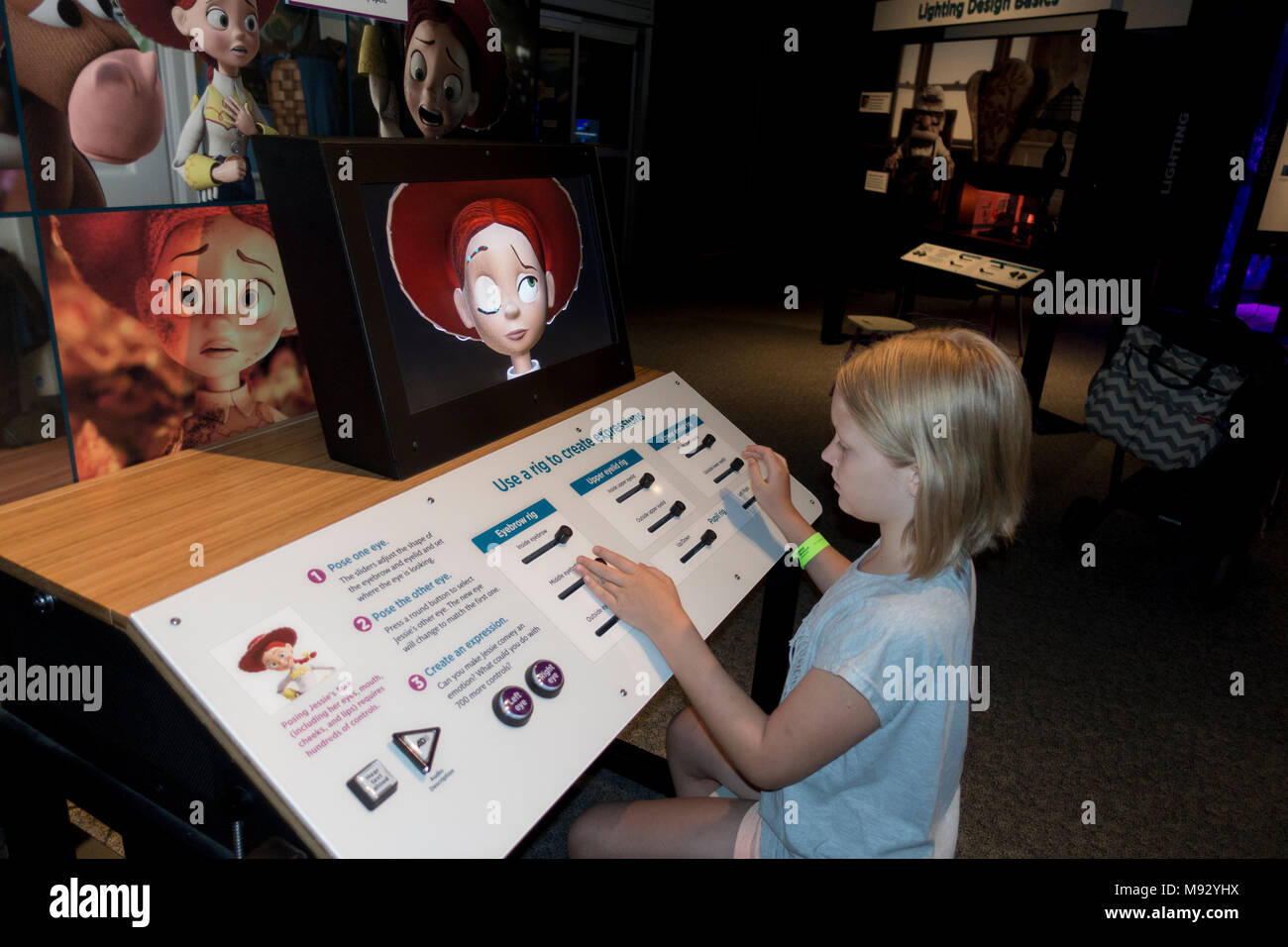 Young girl working at the Pixar Toy Story expression rig controlling ...