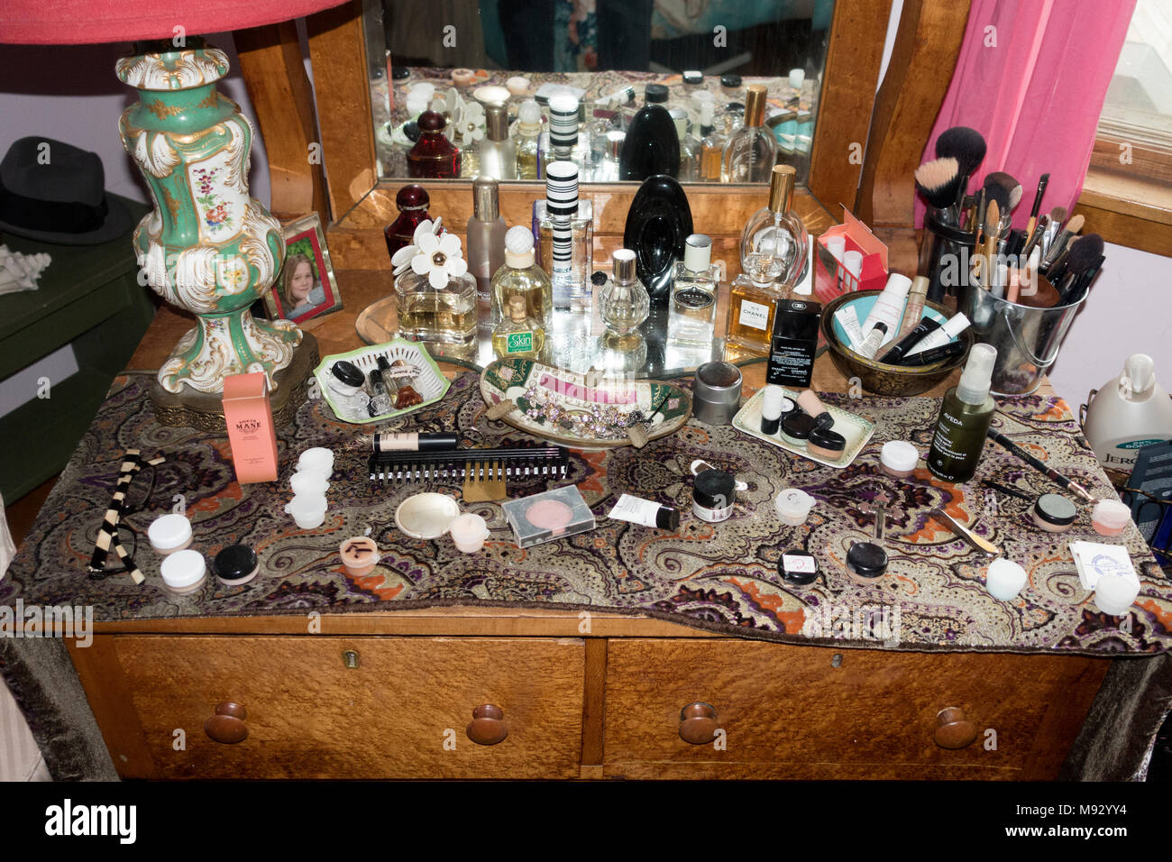 Top of a woman's dressing chest with all the cosmetics and makeup ...