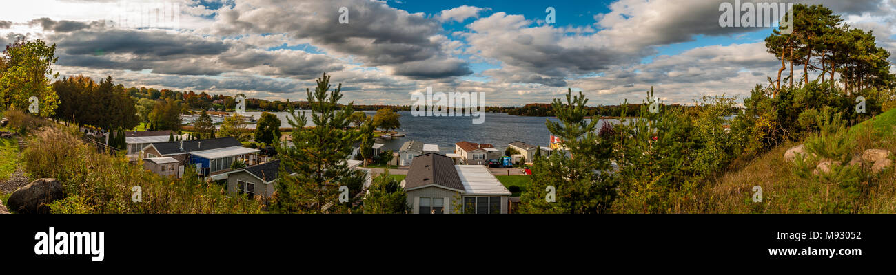 Summer Scenic View featuring lake, summer cottages and a beautiful blue ...