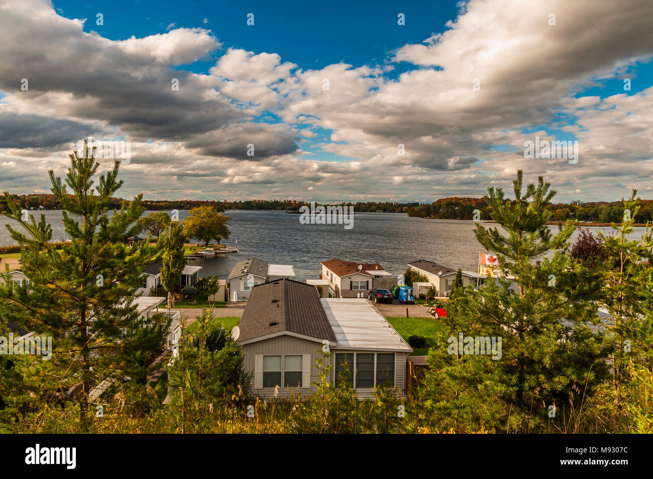 Summer Scenic View featuring lake, summer cottages and a beautiful blue ...