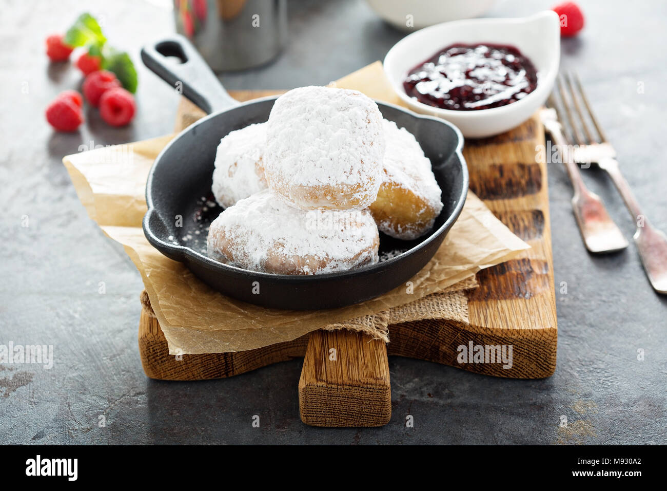 Beignets with powdered sugar and raspberry jam Stock Photo - Alamy