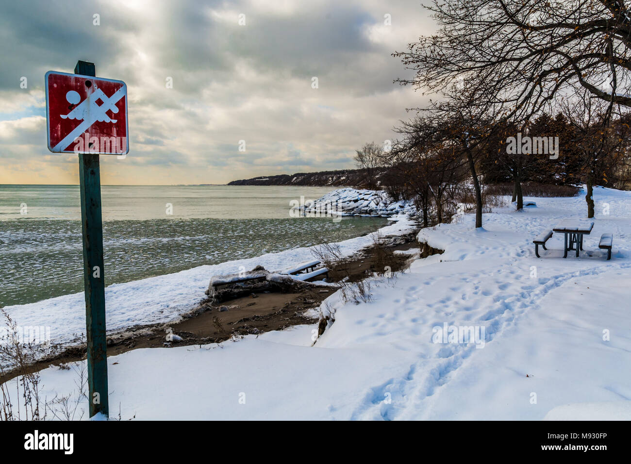 Winter Landscape Scene showing white snow along icy water lake coastal ...
